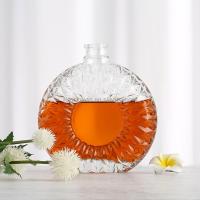 China Round Emboss Glass Bottles The Ultimate Packaging for Hot Vodka Brandy Wine for sale