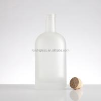 China Super Flint Glass 700ml Frosted Vodka Bottle with Top Grade Custom Printing Logo for sale