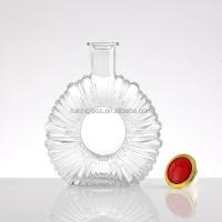 China Super Flint Glass Most Popular Style Flat Mouth Embossed Brandy Glass Bottles for sale
