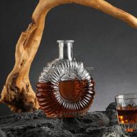 China Super Flint Glass Most Popular Style Flat Mouth Embossed Brandy Glass Bottles for sale