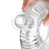 China Super Flint Glass Most Popular Style Flat Mouth Embossed Brandy Glass Bottles for sale