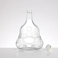 China Style Super Flint Glass Bottle Unique Shape Embossed Body Vodka Brandy Liquor Bottle for sale