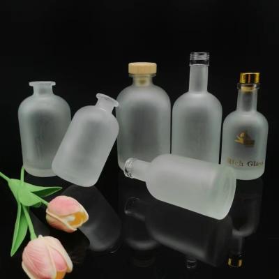 China 500ml 750ml Clear Matte Glass Cork Whiskey Bottles for Bar Hot Stamping B2B Customized for sale