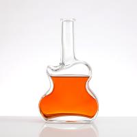 China Super Flint Glass Guitar Shaped Whisky Bottle for Liquor Wine Vodka Tequila for sale