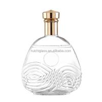 China Transparent Vodka Bottles in Super Flint Glass for Brandy at and Embossed Design for sale