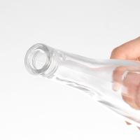 China Empty Liquor Glass Bottle with Lid and Aluminum Plastic PP Collar Material for sale