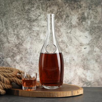 China Aluminum Plastic PP Collar Material 500 ml Transparent Customized Embossed Liquor Bottle for sale