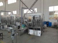 China 12 Pcs Heads Water Bottle Filling Machine Full Automatic CSD Filling Equipment for sale
