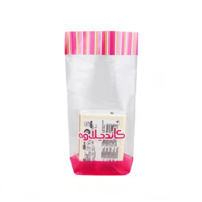 China Food Packaging Stand Up Pouch With Cross Block Bottom And Cellophane Clear Treat for sale