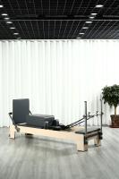 China Adjustable Maple Wood Pilates Reformer U+PL001G with Ergonomic Carriage for sale