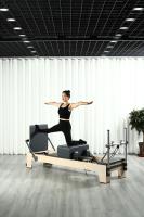 China Adjustable Maple Wood Pilates Reformer U+PL001G with Ergonomic Carriage for sale