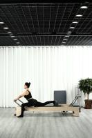 China Adjustable Maple Wood Pilates Reformer U+PL001G with Ergonomic Carriage for sale