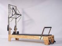 China Tower Resistance Wooden Pilates Equipment Oak Pilates Reformer U+PL006A with Training Module for sale
