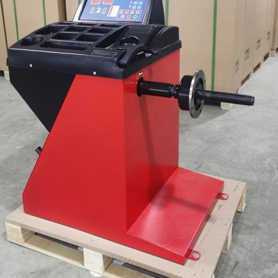 China Standard Cones Car Tyre Balancing Machine Delicate Plastic Hood Automatic Wheel Balancer  Self Calibrating And Self Diagnosis Programs Tire Balancing Equipment for sale