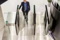 China Swing Barrier Turnstile featuring automatic arm open on power off and delayed close for emergency and operational safety for sale