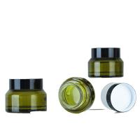 China Round Glass Cosmetic Packaging Bottle with Silk Screen Printing for sale