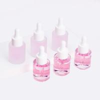 China Simple Round Glass Foundation Bottle with Free Samples Transparent Glossy Finish for sale