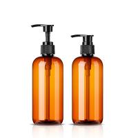 China Amber Boston Round Shape Empty Lotion Bottle With Neck Size 24/410 Pump for sale