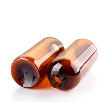 China Amber Boston Round Shape Empty Lotion Bottle With Neck Size 24/410 Pump for sale