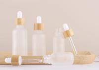 China BPA Free Lead Free Round 50ml Glass Dropper Bottles With Bamboo Collar for sale