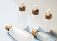 China BPA Free Lead Free Round 50ml Glass Dropper Bottles With Bamboo Collar for sale