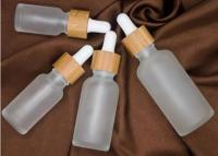 China BPA Free Lead Free Round 50ml Glass Dropper Bottles With Bamboo Collar for sale
