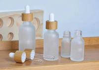 China BPA Free Lead Free Round 50ml Glass Dropper Bottles With Bamboo Collar for sale