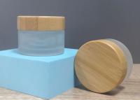 China JiaZi Frosted Clear Glass Cosmetic Jar Wood Grain Lids 50g Bamboo Cream Jar for sale