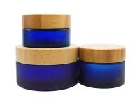 China 50ml 100ml Bamboo Glass Cosmetic Jar Empty Body Butter Containers With Paper Box for sale