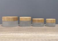 China 50ml Green Glass Ointment Jars Bamboo Lid  Frosted Cream Jar Logo Customization for sale