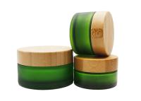China 50ml Green Glass Ointment Jars Bamboo Lid  Frosted Cream Jar Logo Customization for sale