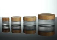 China 50ml Green Glass Ointment Jars Bamboo Lid  Frosted Cream Jar Logo Customization for sale