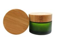 China 50ml Green Glass Ointment Jars Bamboo Lid  Frosted Cream Jar Logo Customization for sale