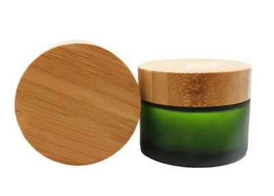 China 50ml Green Glass Ointment Jars Bamboo Lid  Frosted Cream Jar Logo Customization for sale