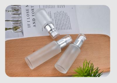 China 1 Ounce Glass Spray Cosmetic Pump Bottle With Silver Caps User Friendly for sale