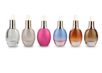 China Unique Shape 1oz Empty Cosmetic Bottles Custom Logo With Rose Gold Dropper for sale