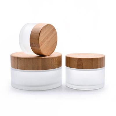 China 50g Bamboo Lid Cosmetic Jar , Glass Face Cream Jars Wear Resisting for sale