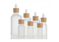 China Empty Essential Oil Bamboo Cap 30ml Glass Dropper Bottle Transparent Frosted for sale
