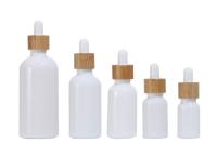 China Opal White Porcelain Ceramic 30ml 50ml Glass Dropper Bottle With Bamboo Cap for sale