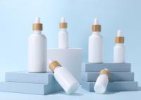 China Opal White Porcelain Ceramic 30ml 50ml Glass Dropper Bottle With Bamboo Cap for sale