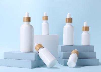 China Opal White Porcelain Ceramic 30ml 50ml Glass Dropper Bottle With Bamboo Cap for sale