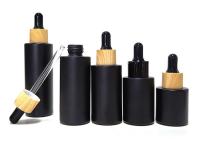 China 1 Oz Transparent Empty Cosmetic Glass Serum Matte Dropper Bottles With Paper Tubes for sale