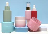 China Matte Pink Flat Shoulder 30ml Frosted Glass Dropper Bottles With Pump for sale
