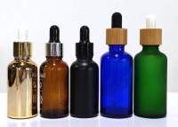 China 100 Ml Essential Oil Black Glass Dropper Bottle With Bamboo Lids for sale