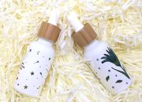 China 100 Ml Essential Oil Black Glass Dropper Bottle With Bamboo Lids for sale