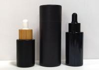 China Empty Paper Tube Cosmetic Packaging Glass Dropper Bottles Black 2oz for sale
