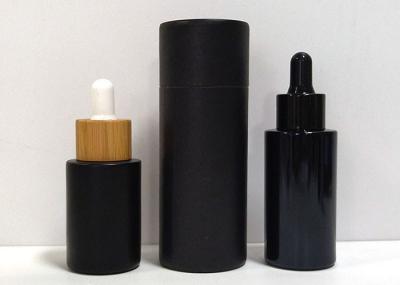 China Empty Paper Tube Cosmetic Packaging Glass Dropper Bottles Black 2oz for sale