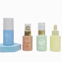 China 30ml 1oz Mixed Colour Glass Essential Bottle With Pump Luxury Skincare Packaging for sale