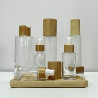 China Matte Bamboo Glass Bottle 20ml 30ml Glass Pump Spray Makeup Dropper for sale