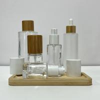 China Matte Bamboo Glass Bottle 20ml 30ml Glass Pump Spray Makeup Dropper for sale